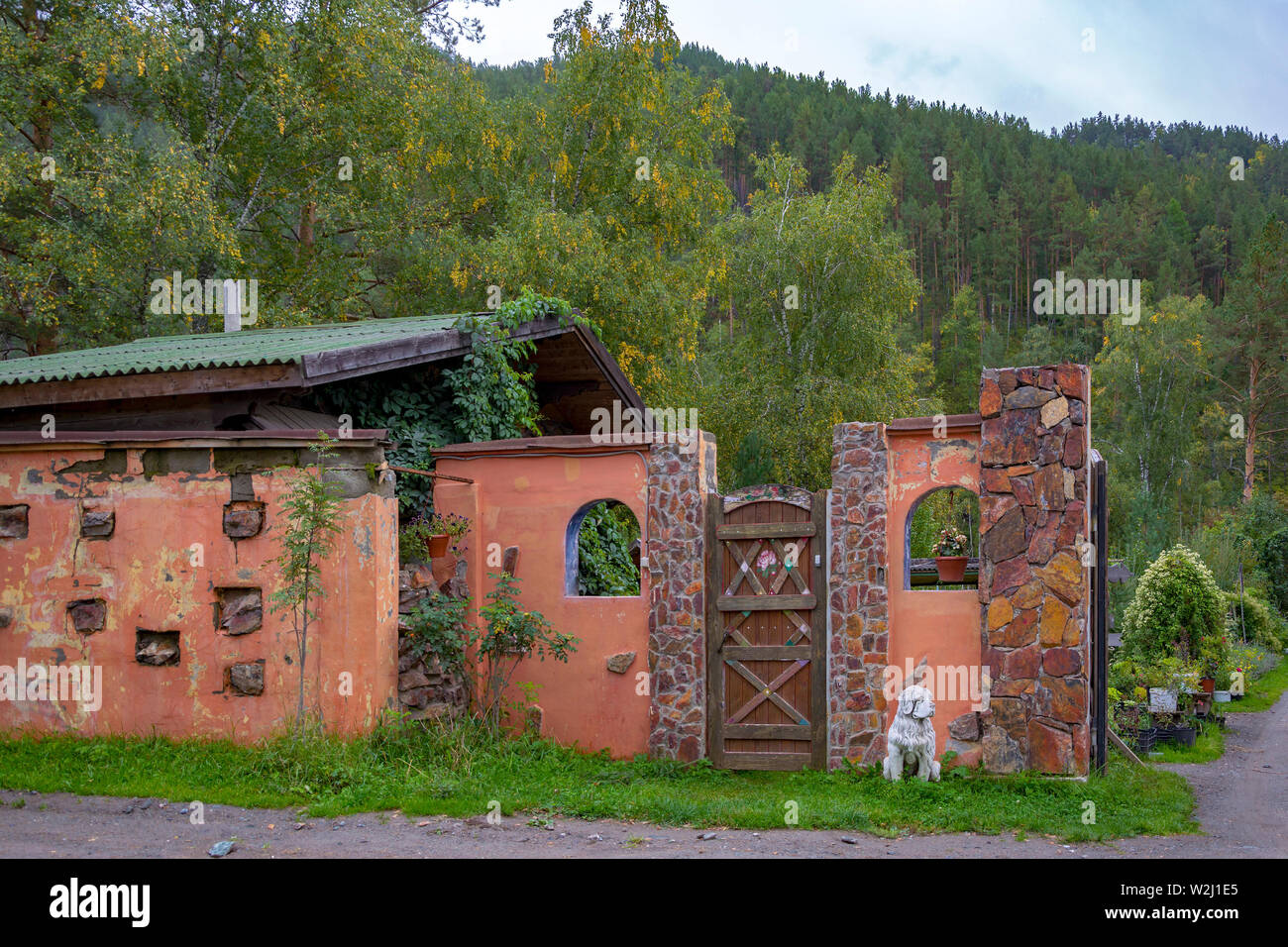 Garden house and garden gate located in a mountain valley Stock Photo ...