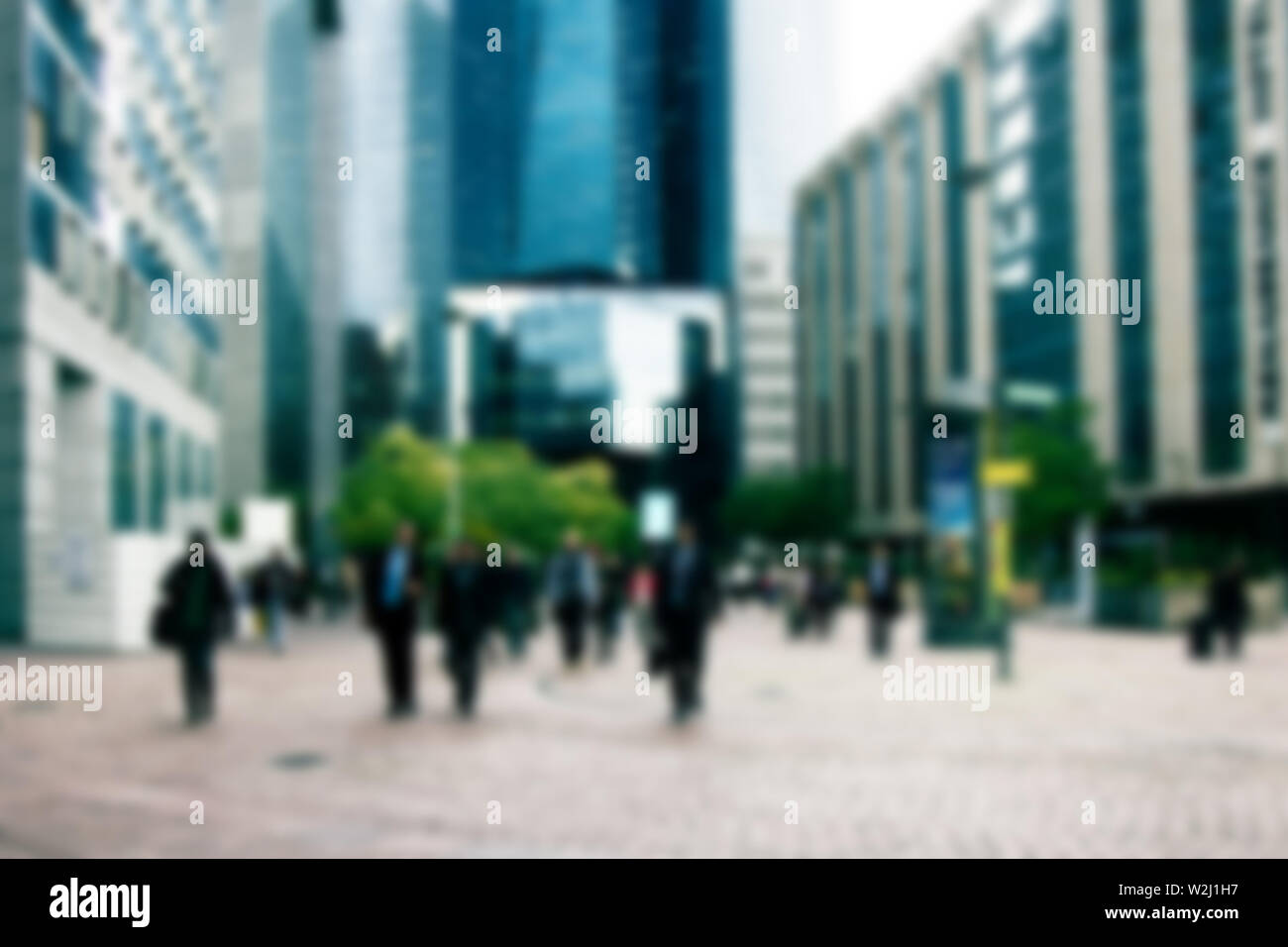 People are strong blurred anonymous. Business quarter with bulk of ...