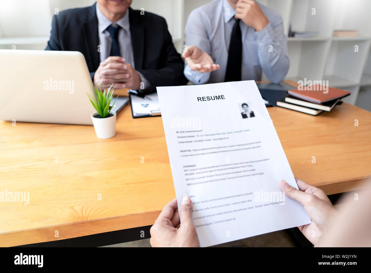 businessman professional women in suit explaining about her profile to ...