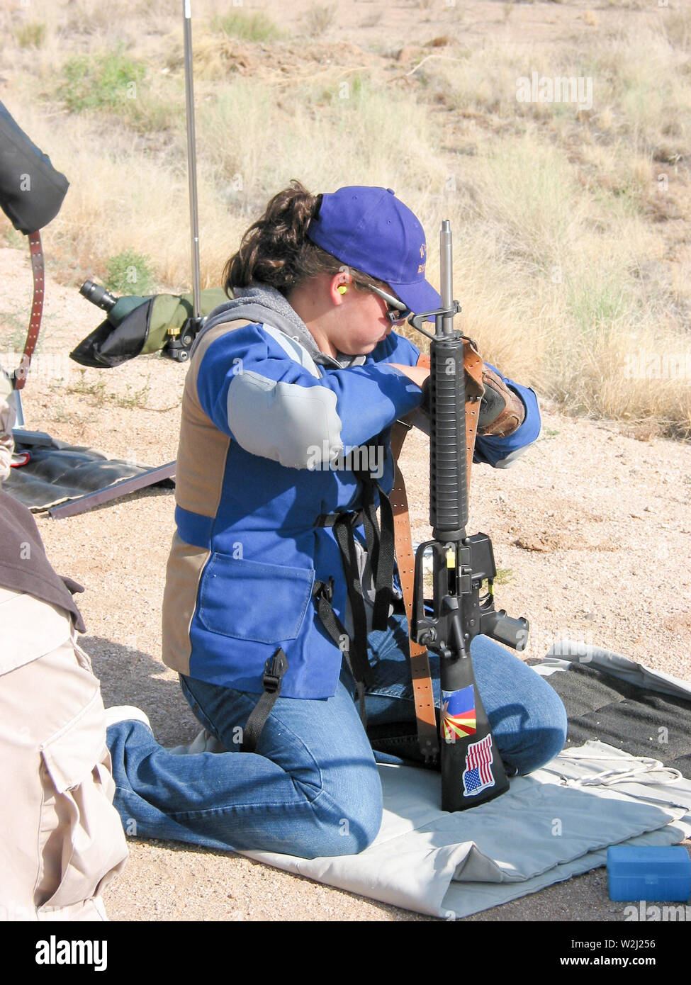 Young people shooting guns and firing range Stock Photo - Alamy