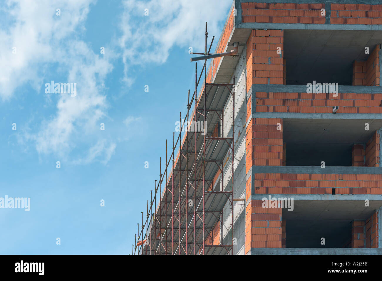 Scaffolding on empty construction site with unfinished incomplete ...