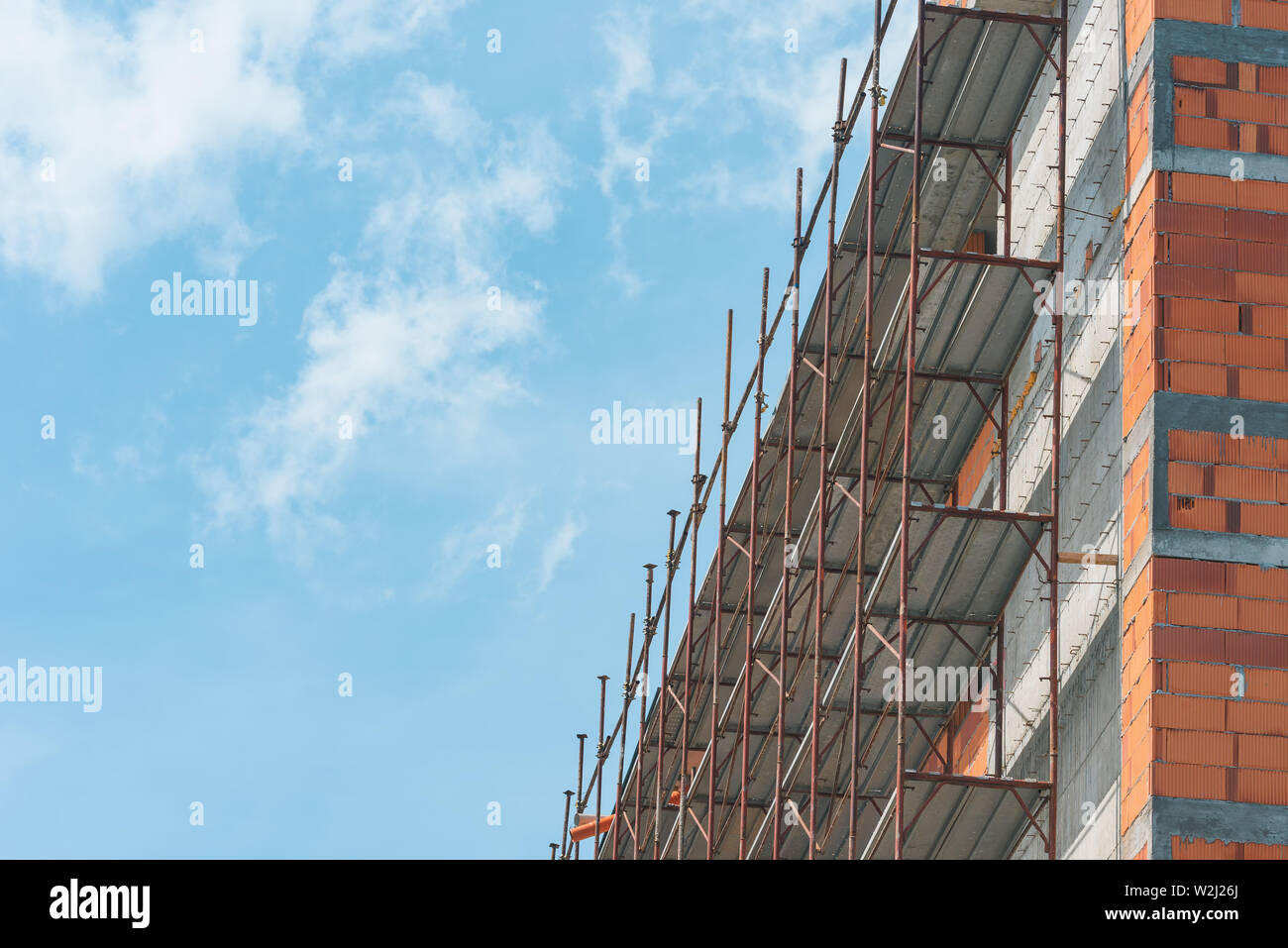 Scaffolding on empty construction site with unfinished incomplete ...