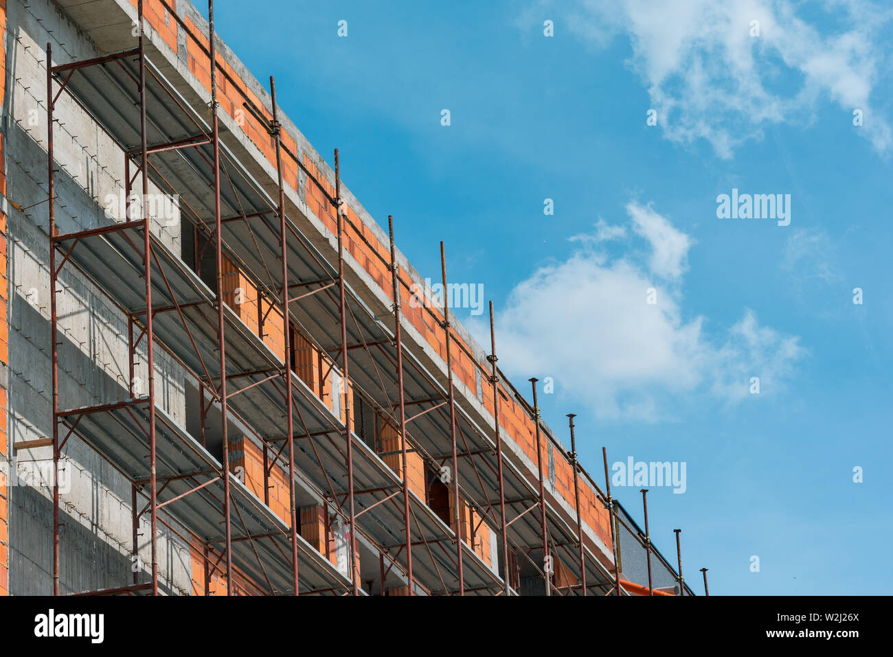 Scaffolding on empty construction site with unfinished incomplete ...