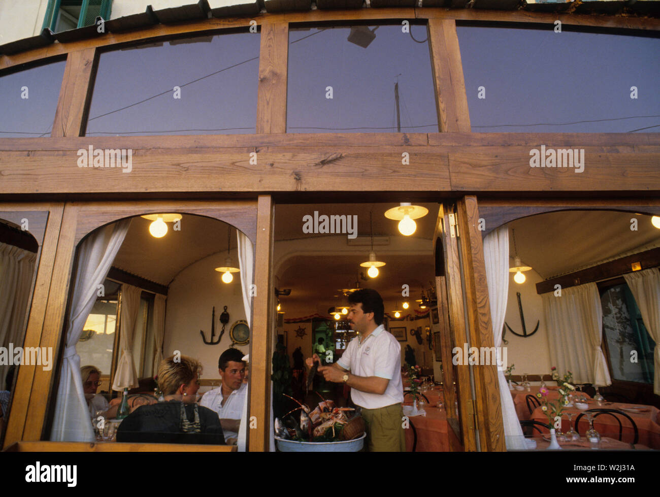 restaurants at the port, ischia island, gulf of naples campania, italy ...