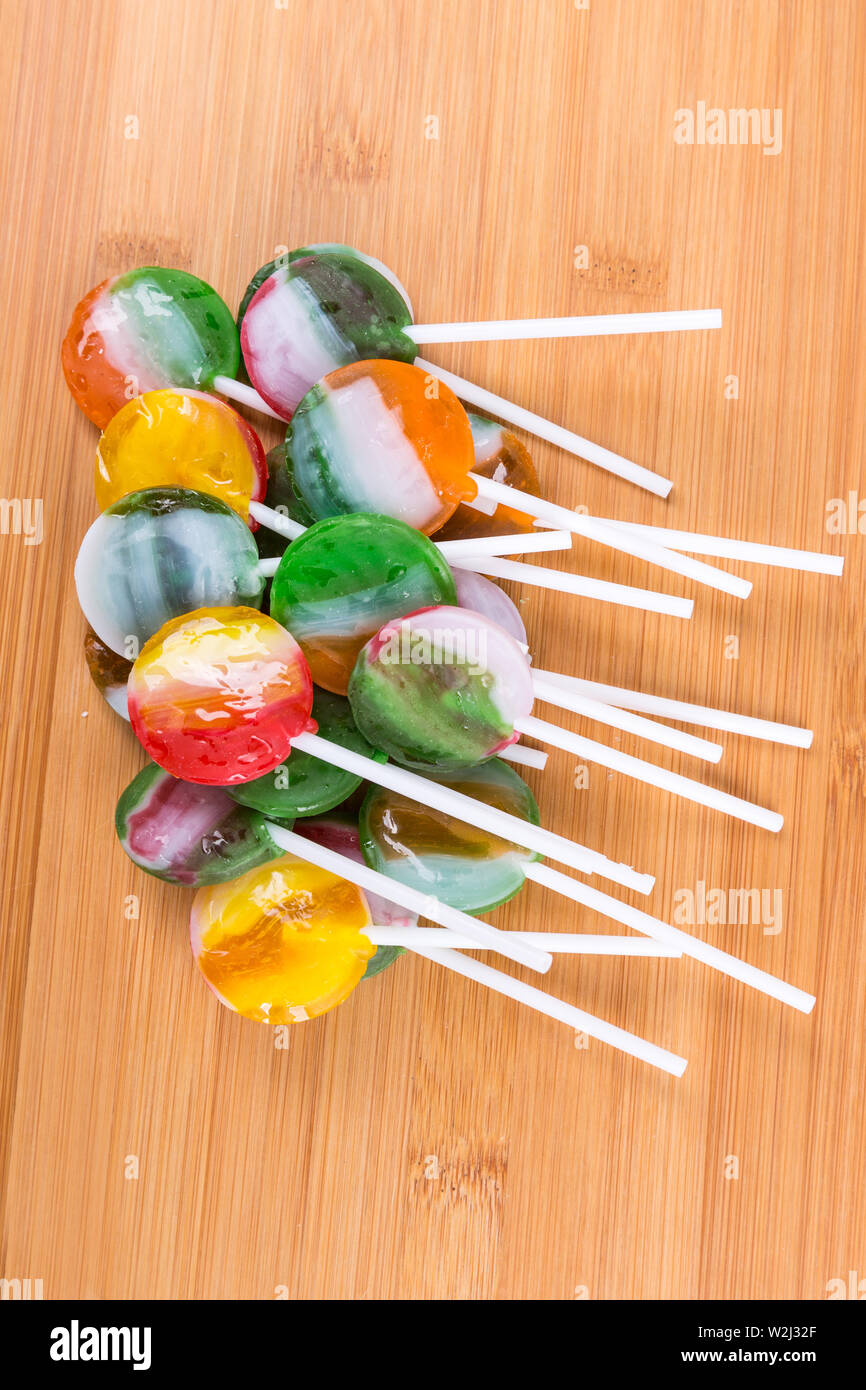 Colorful arrangement of candy suckers on sticks Stock Photo - Alamy