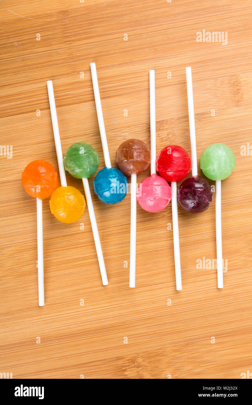 Colorful arrangement of candy suckers on sticks Stock Photo - Alamy