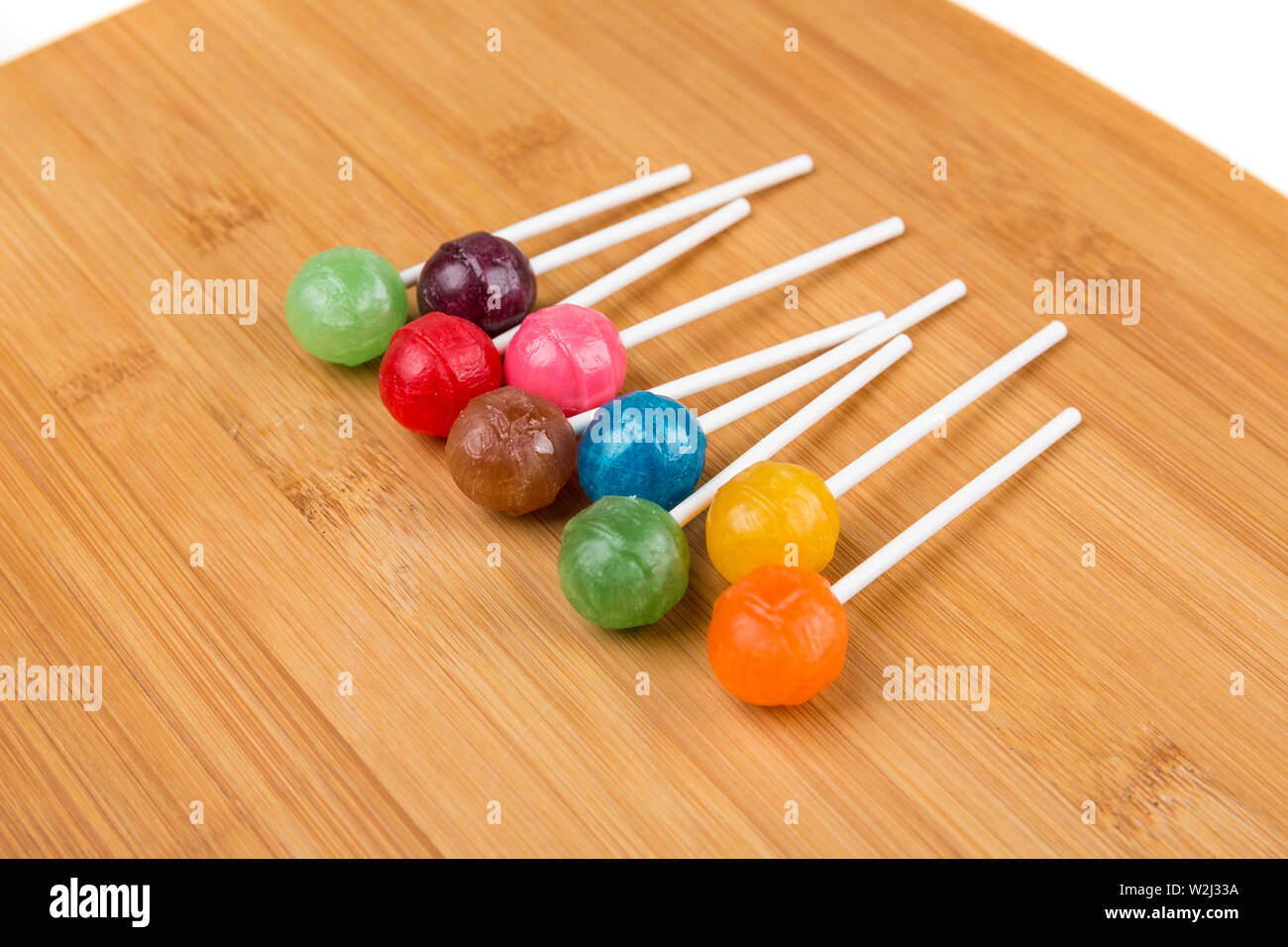 Colorful arrangement of candy suckers on sticks Stock Photo - Alamy