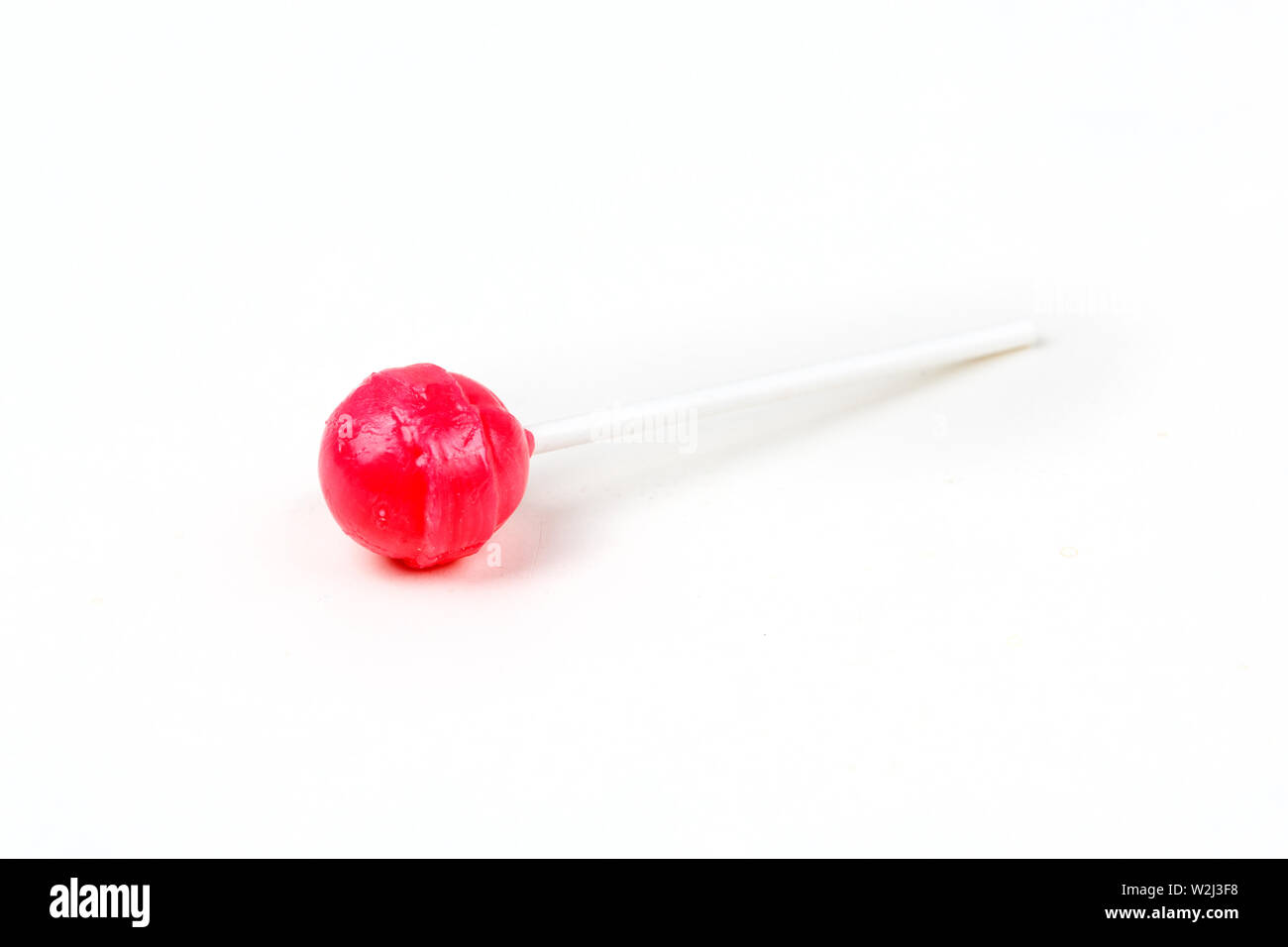 Single colorful candy sucker on a stick Stock Photo - Alamy