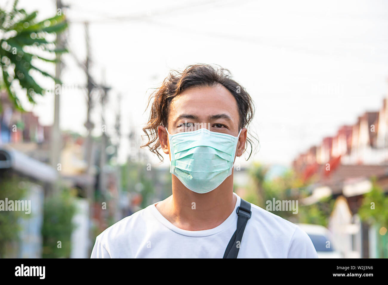 Asean man wear a mask to prevent dust in Bangkok ,Thailand Stock Photo ...