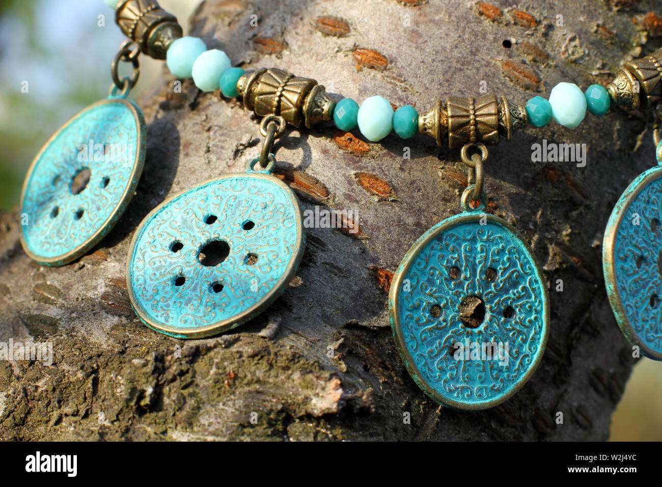 a Handmade metal necklace on the nature background ethnical style Stock ...