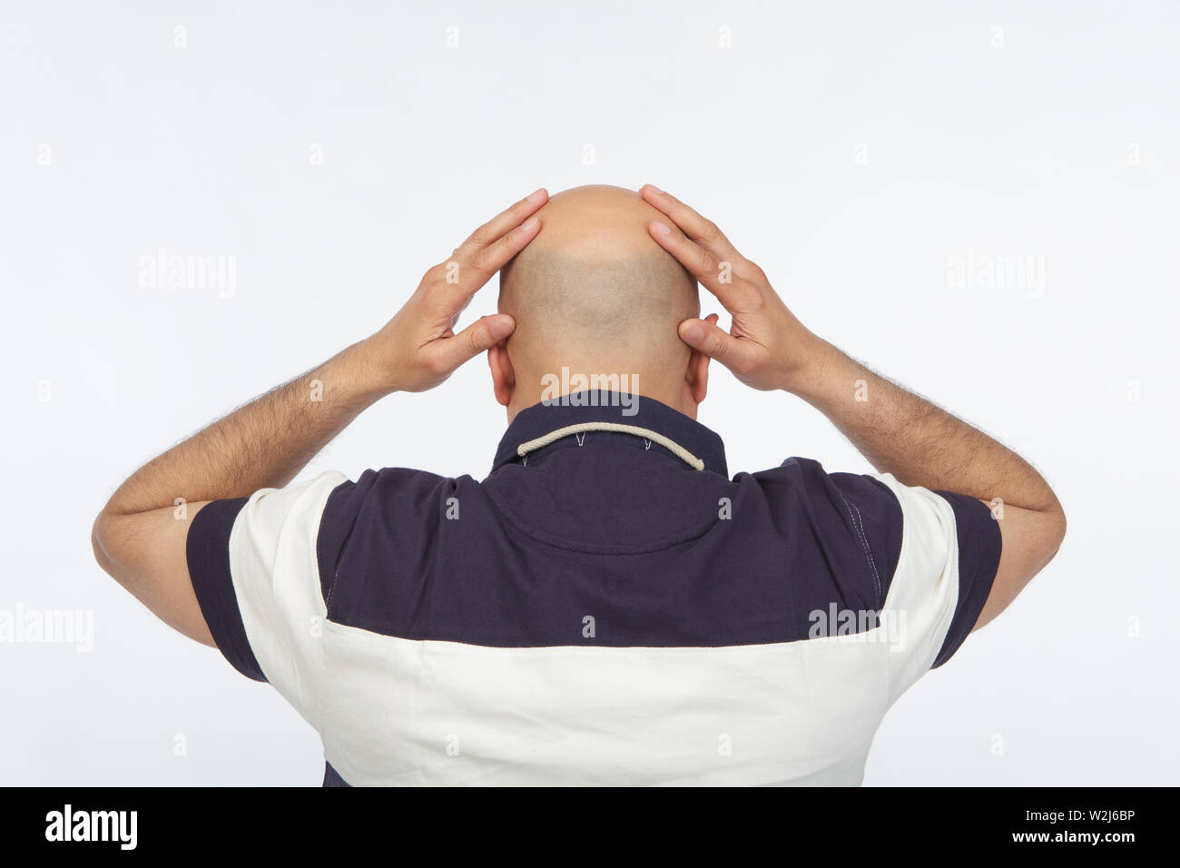 Rear view of an Indian bald man Stock Photo - Alamy