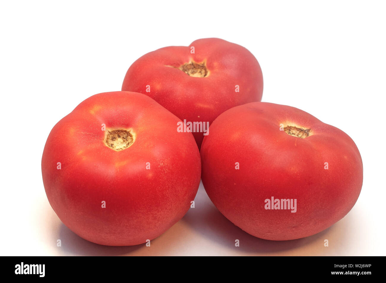 Red ripe tomatoes isolated on white background Stock Photo - Alamy