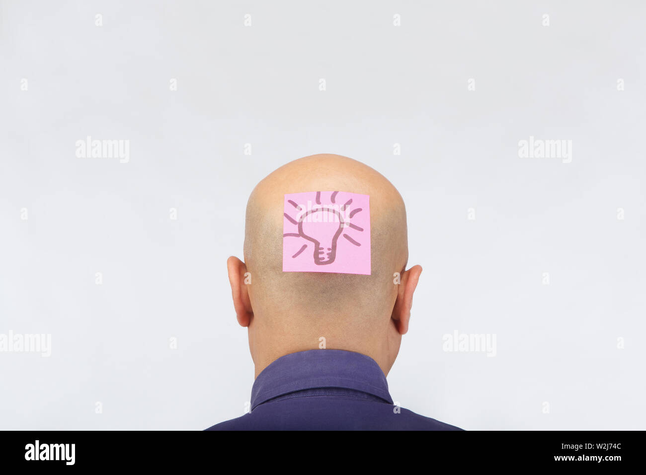 Indian businessman with adhesive note on back of head Stock Photo - Alamy