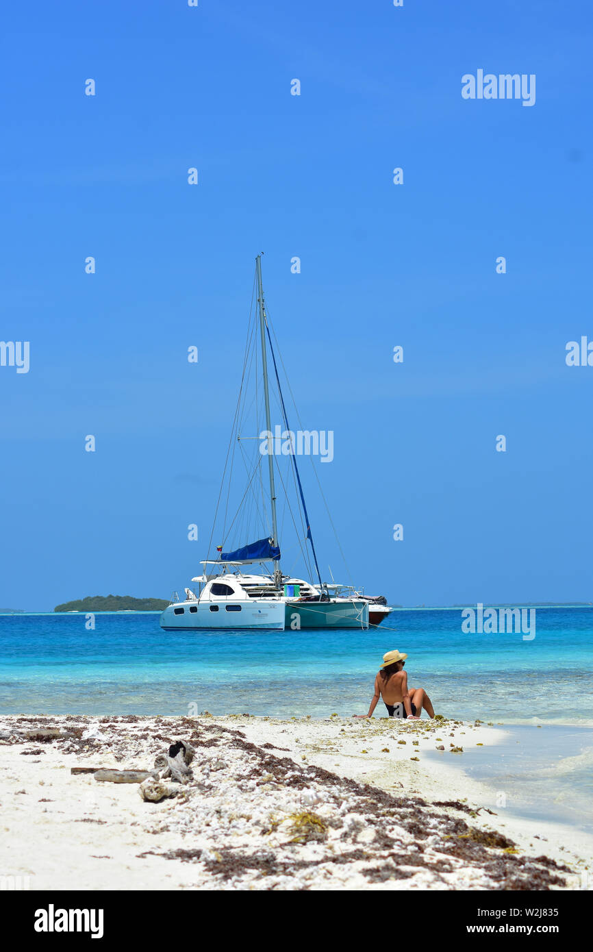 sailboat on the beach woman Stock Photo - Alamy