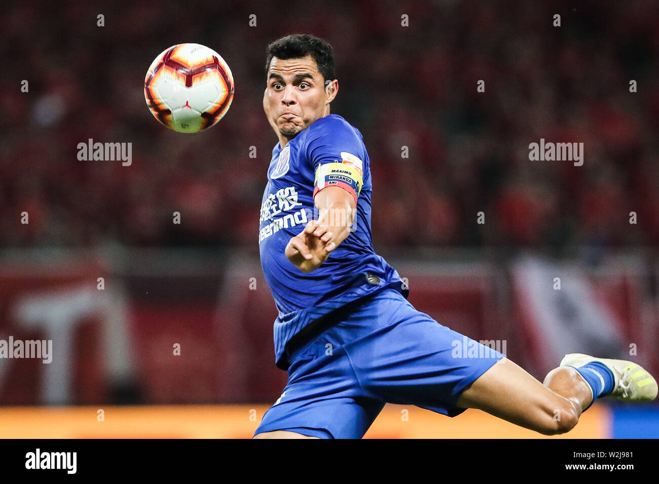 Colombian football player Giovanni Moreno, top, of Shanghai Greenland ...