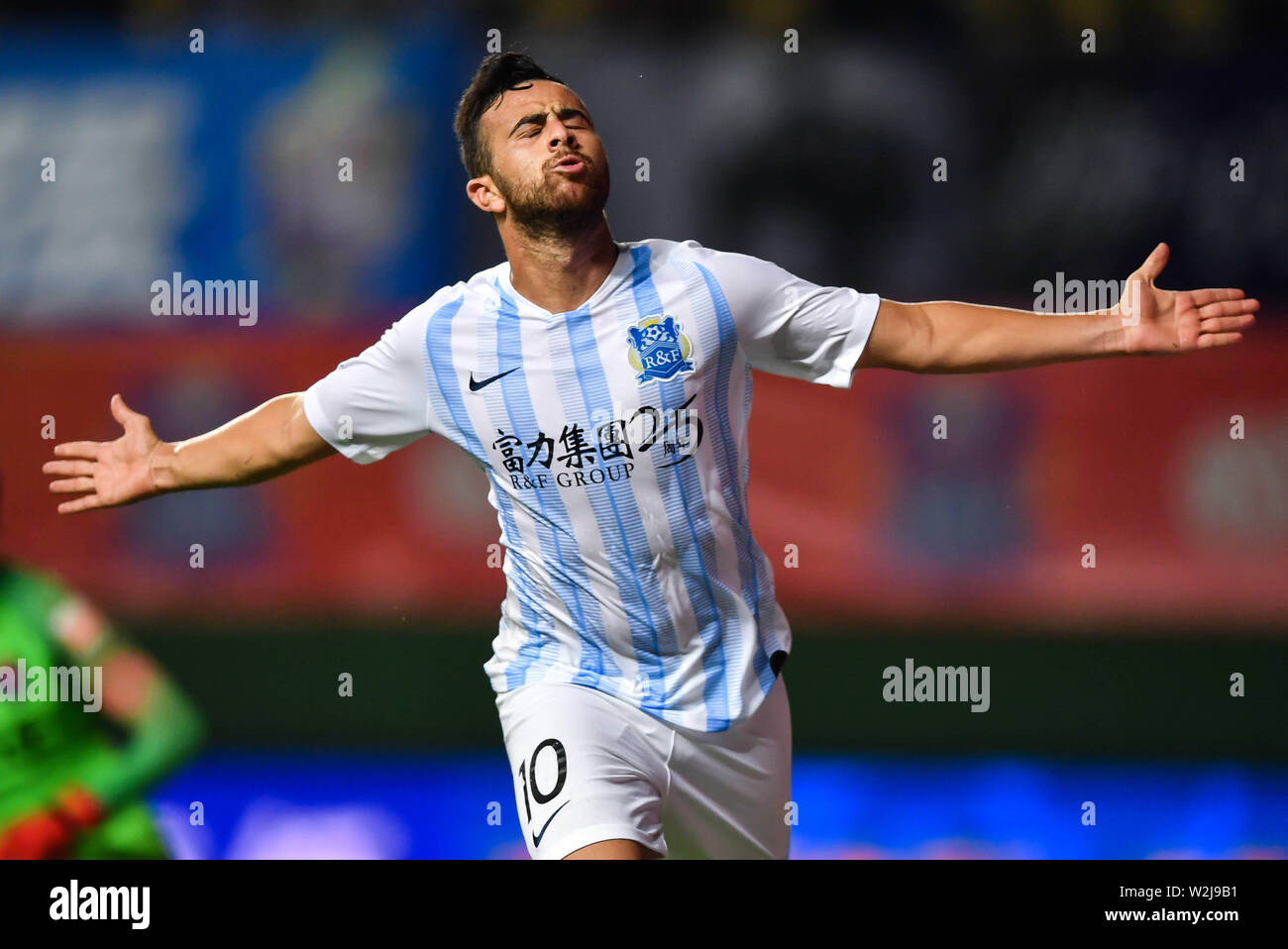 Israeli-Arab football player Dia Saba of Guangzhou R&F celebrates after ...