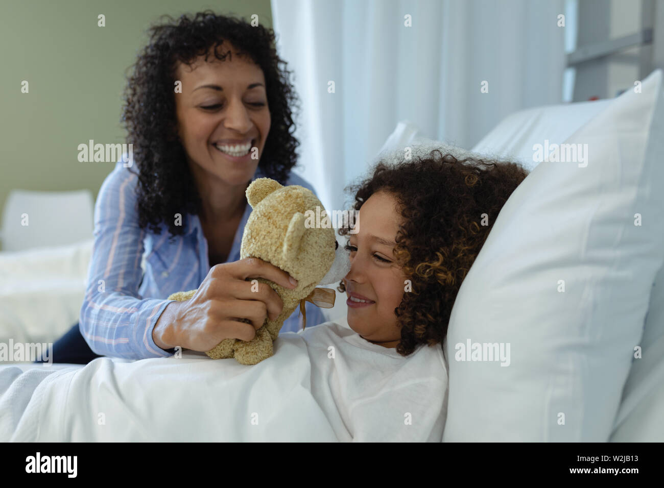 Mother and son playing together in the ward at hospital Stock Photo - Alamy