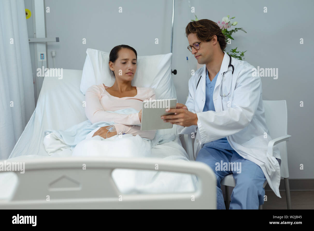Male female doctor discussing over hi-res stock photography and images ...