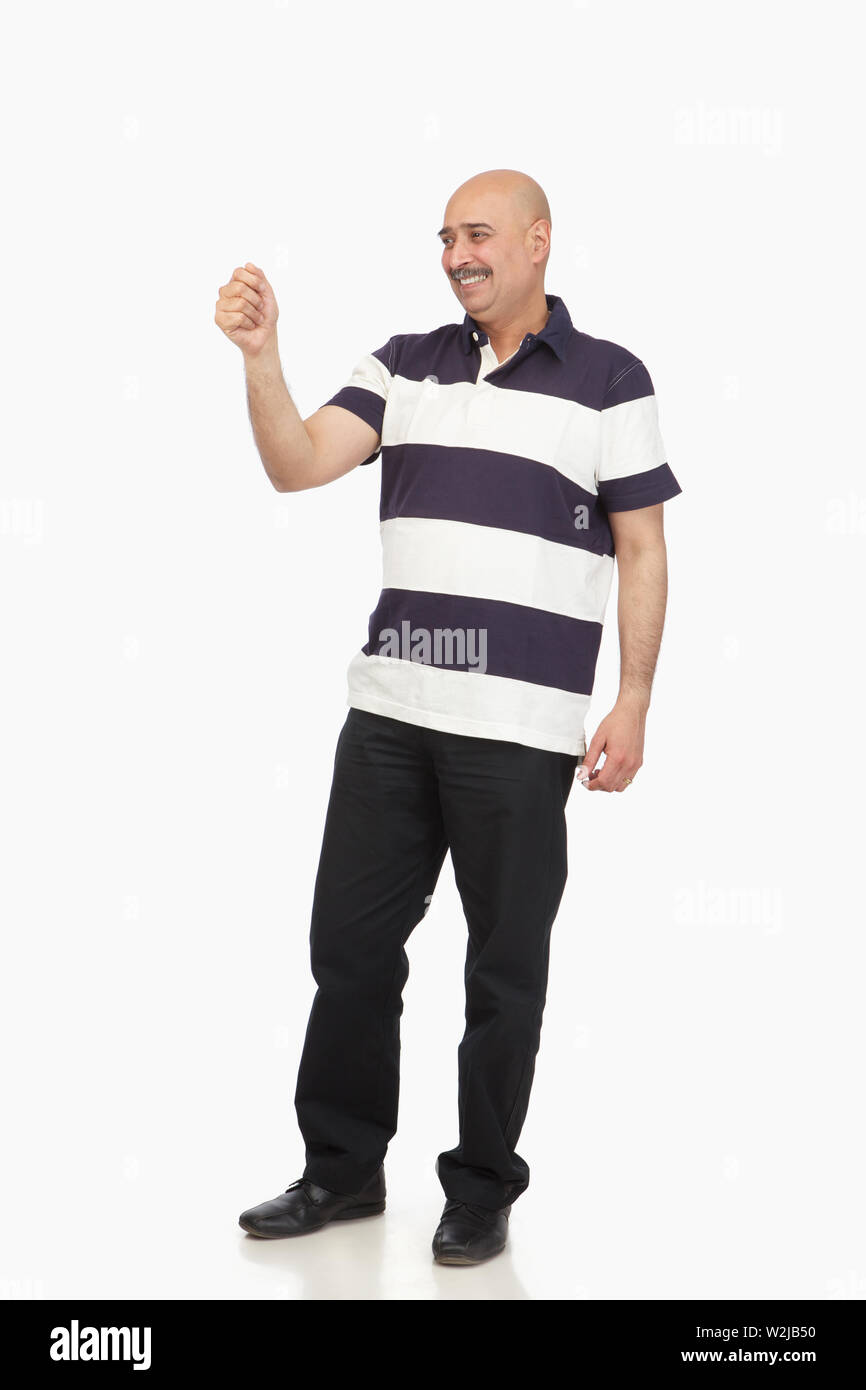 Man standing and smiling Stock Photo - Alamy