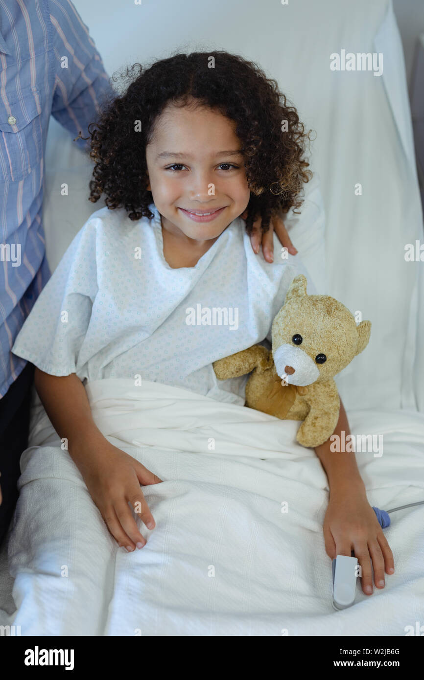 Boy patient sitting on bed in the ward at hospital Stock Photo - Alamy