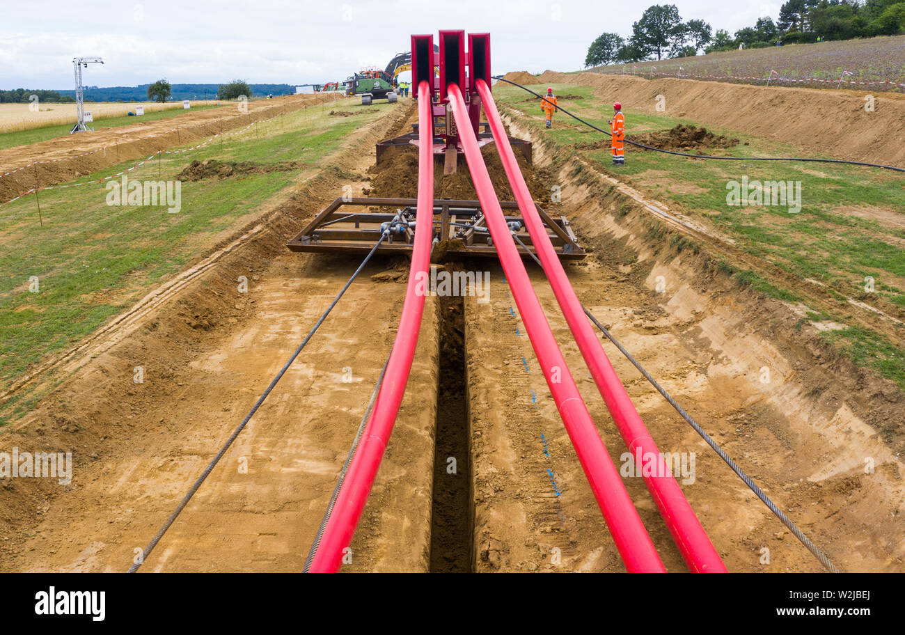 09 July 2019, Lower Saxony, Burgdorf: With a multiple plough for laying ...