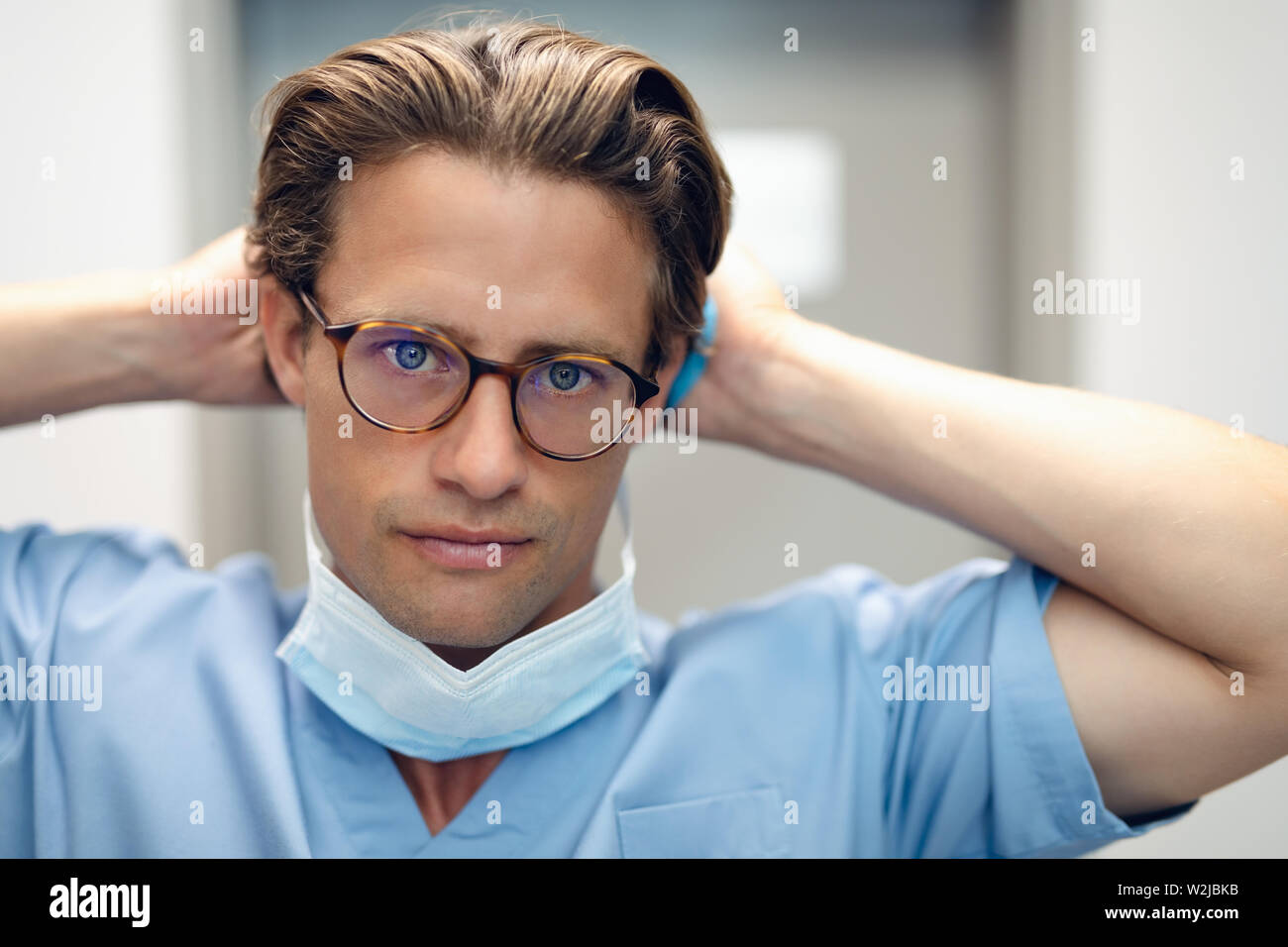 Removing the mask hi-res stock photography and images - Alamy