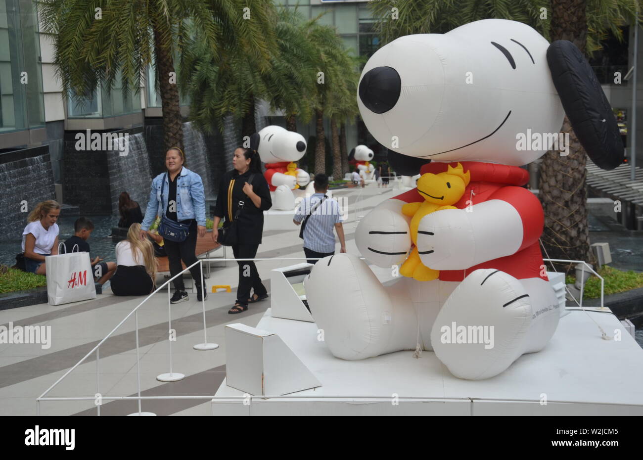 An inflated Snoopy at the entrance of the Siam Paragon shopping centre ...