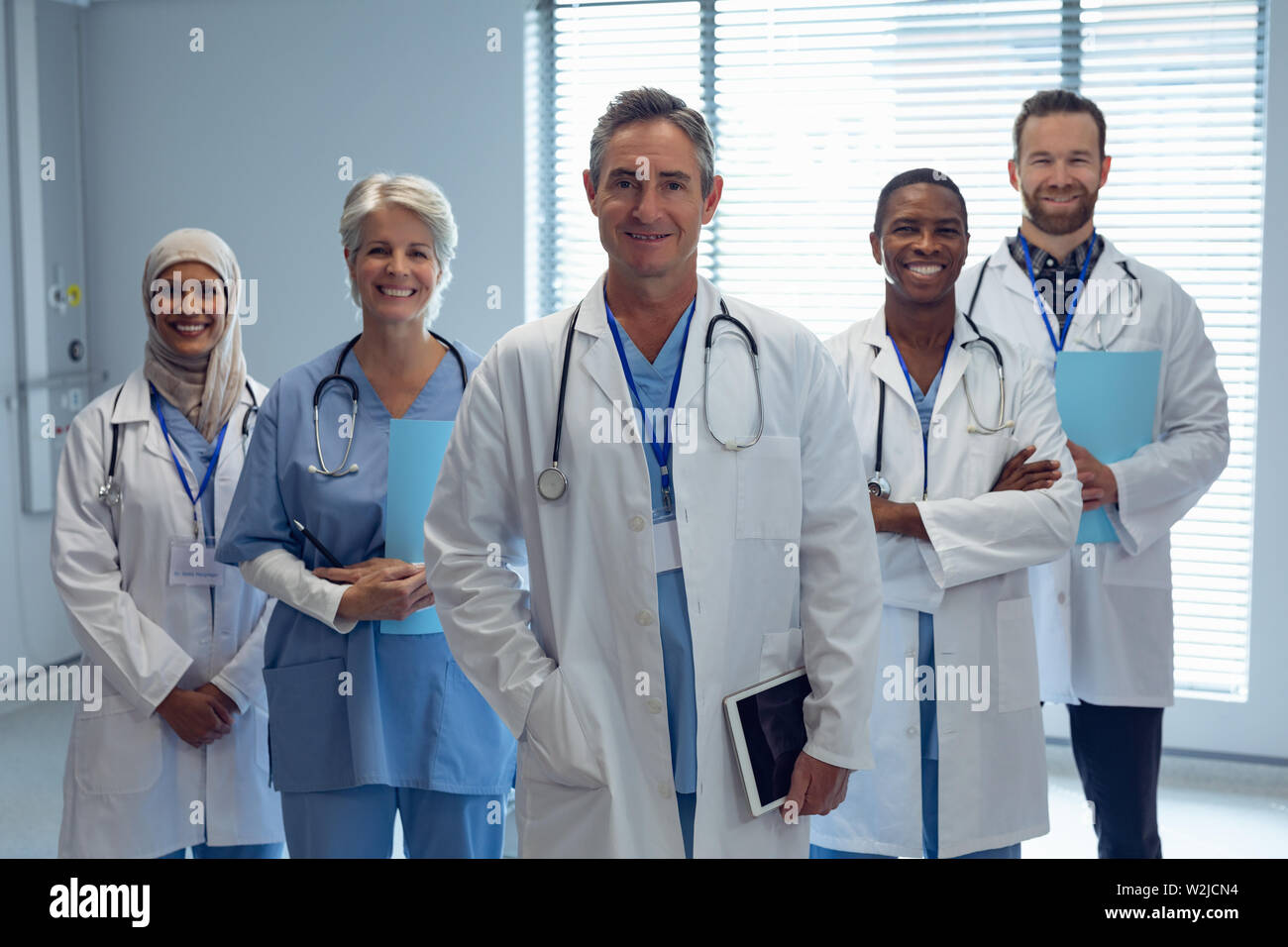 Medical team standing together in hospital Stock Photo - Alamy