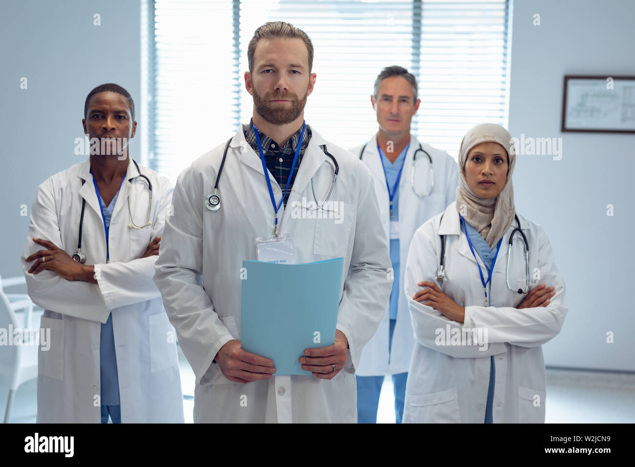 Medical team standing together in hospital Stock Photo - Alamy