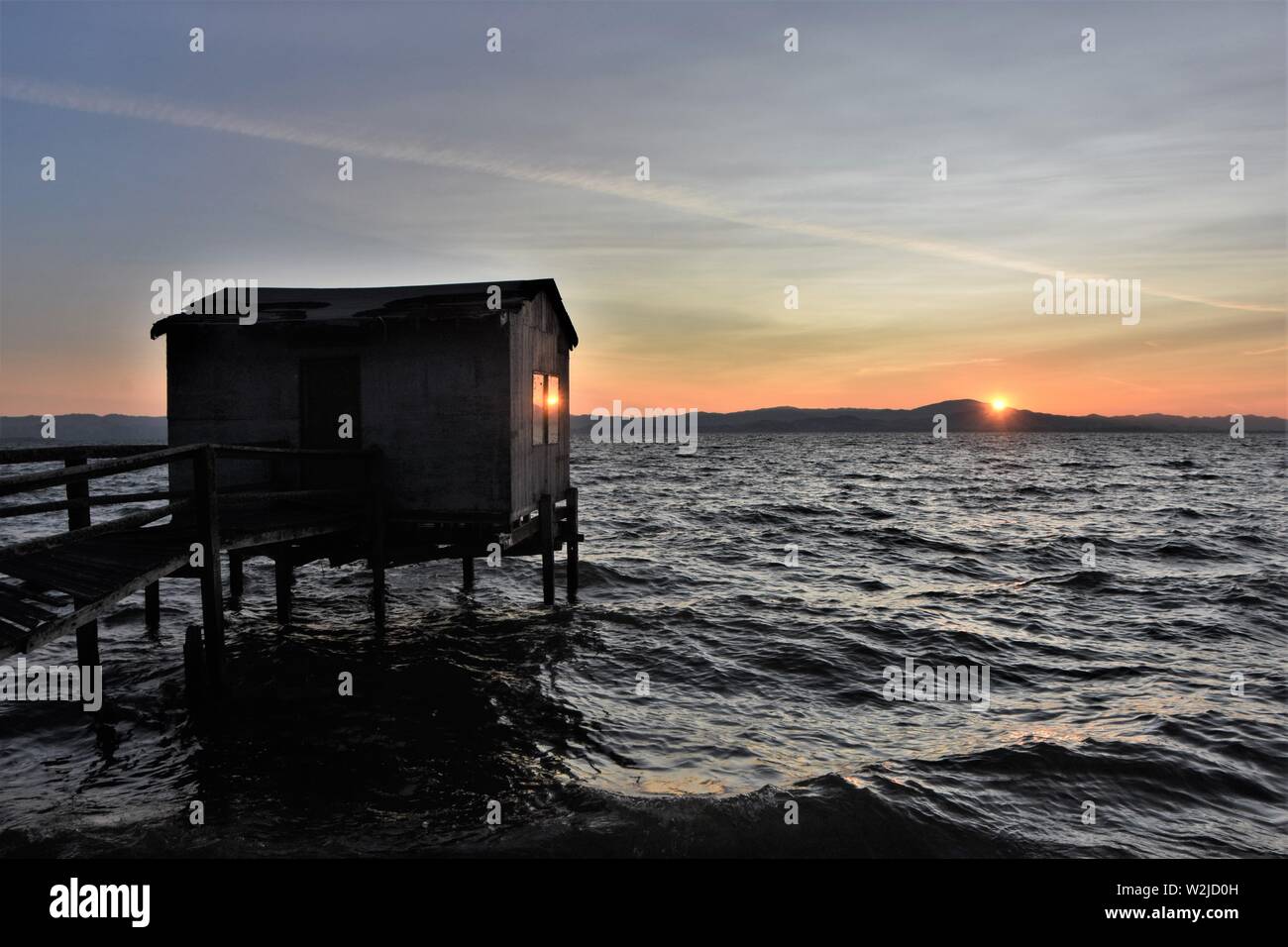 Old boat house on dock in Clear Lake California which is falling apart ...