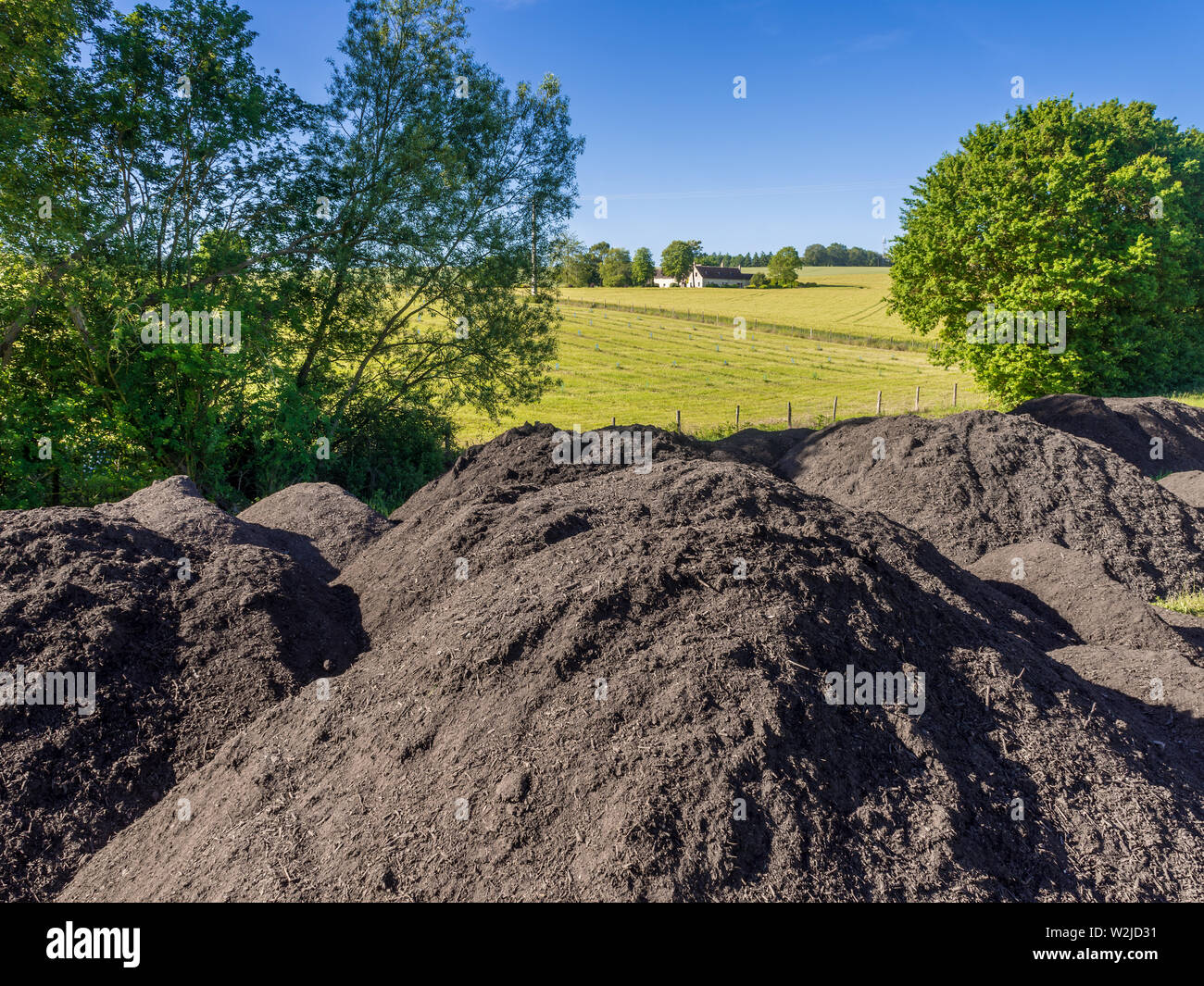 Piles of agricultural compost for spreading on farmland - central ...