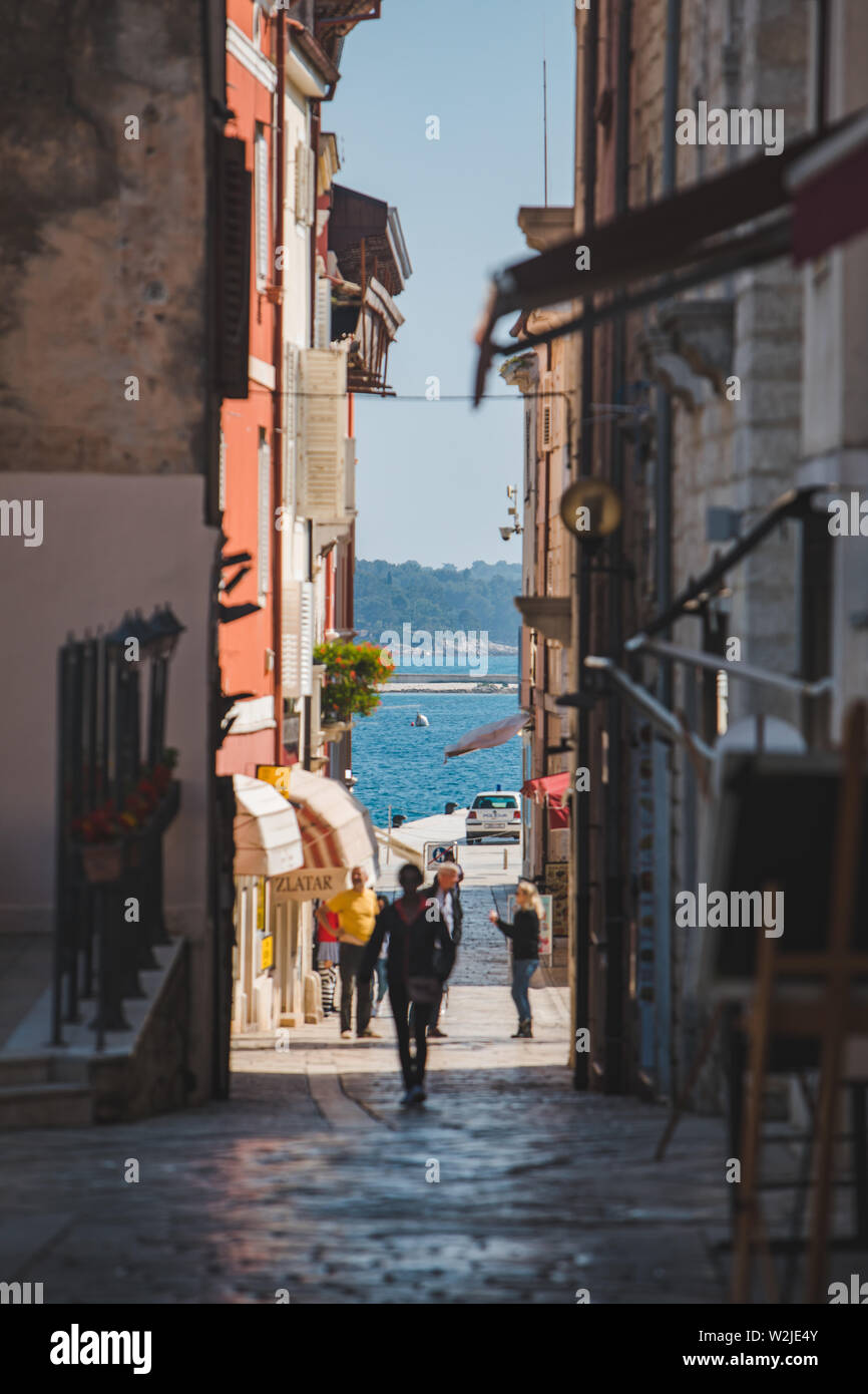 POREC, CROATIA - May 22, 2019: view of street with sea in the end ...