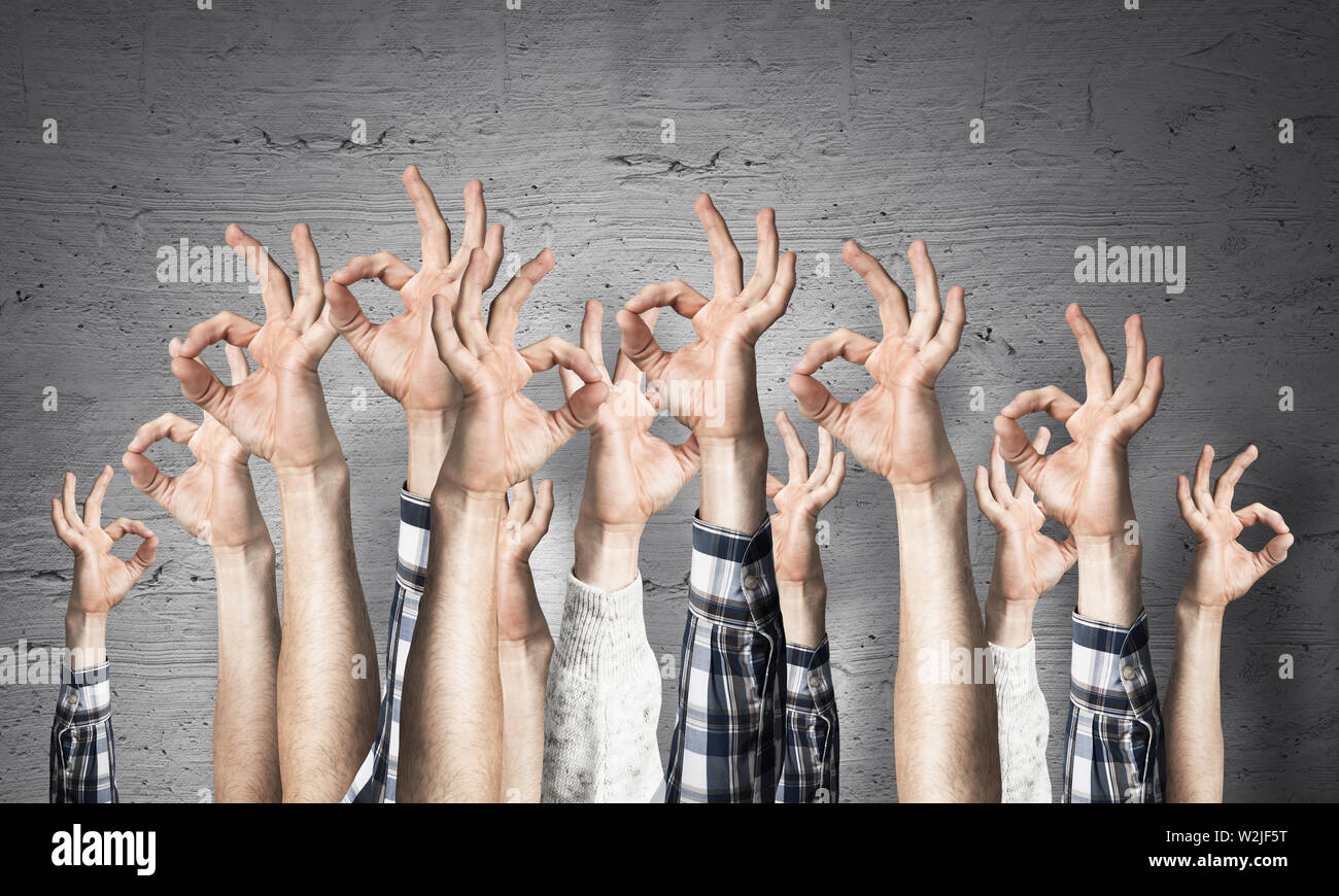Row of man hands showing okay gesture Stock Photo - Alamy