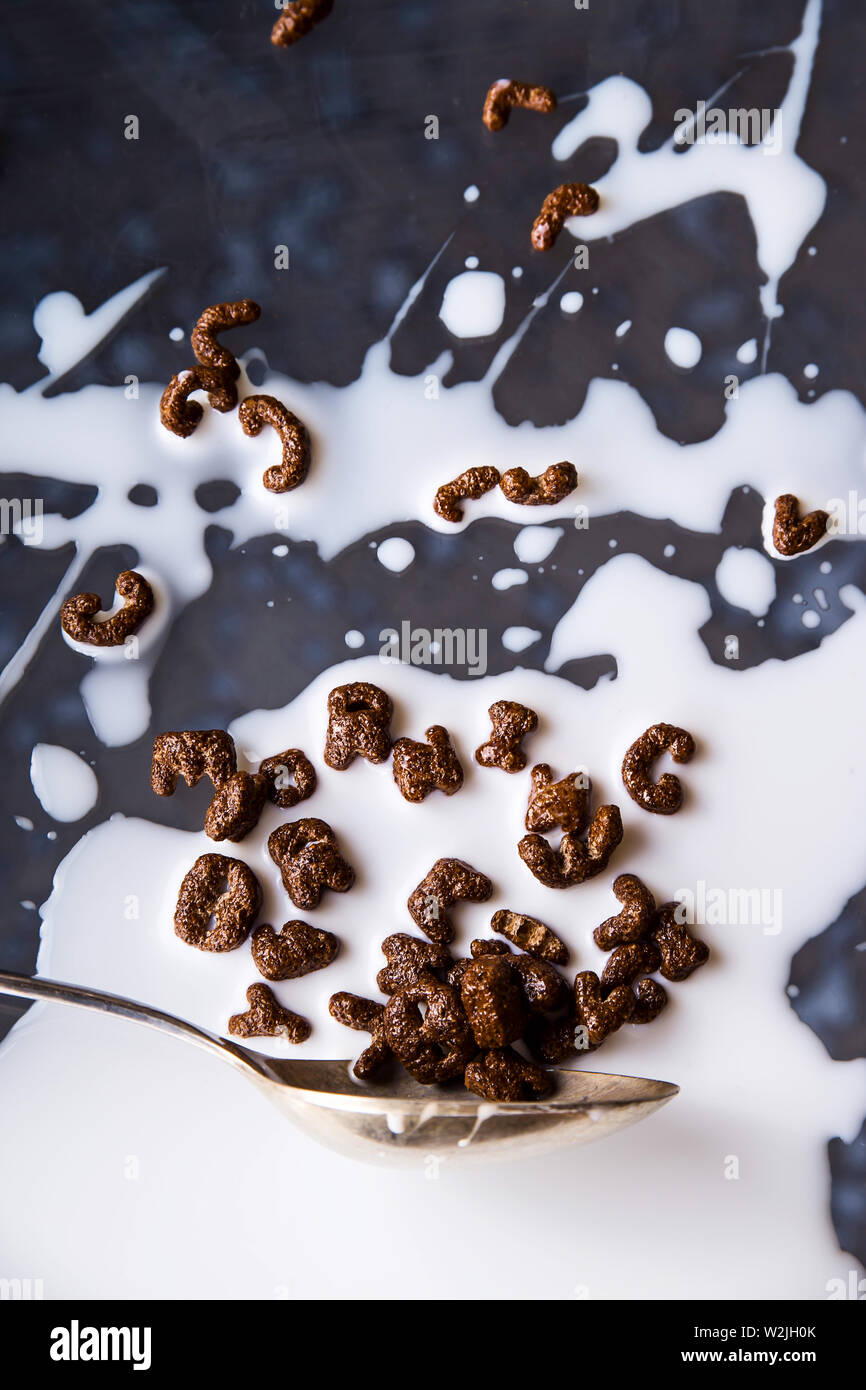 Chocolate cornflakes in the shape of letters of the English alphabet ...