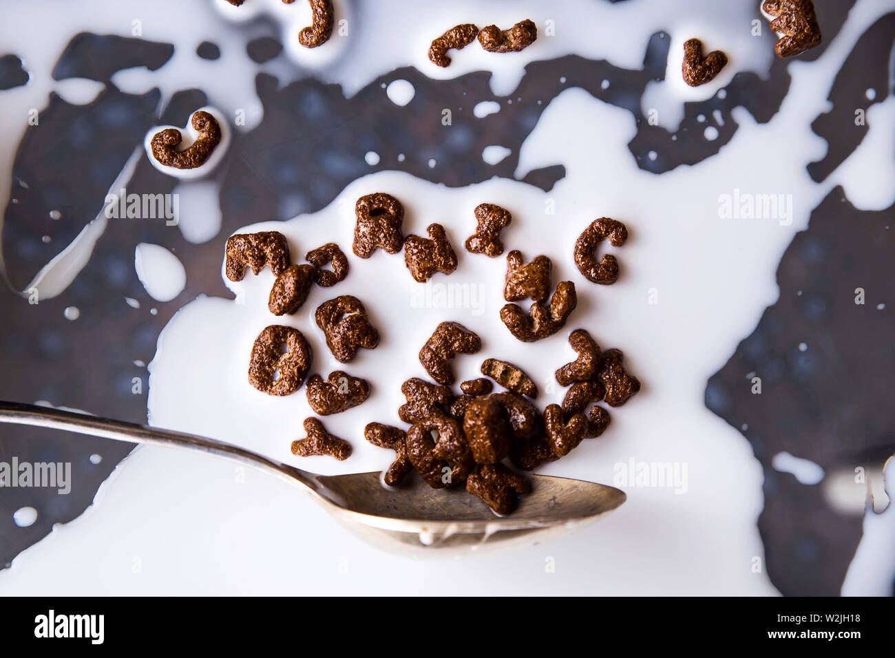 Chocolate cornflakes in the shape of letters of the English alphabet ...