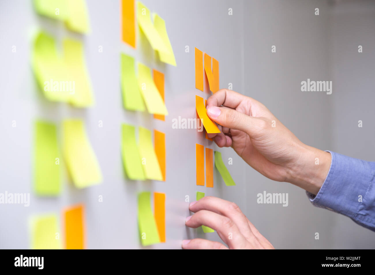 It Worker Tracking His Tasks On Kanban Board Using Task Control Of