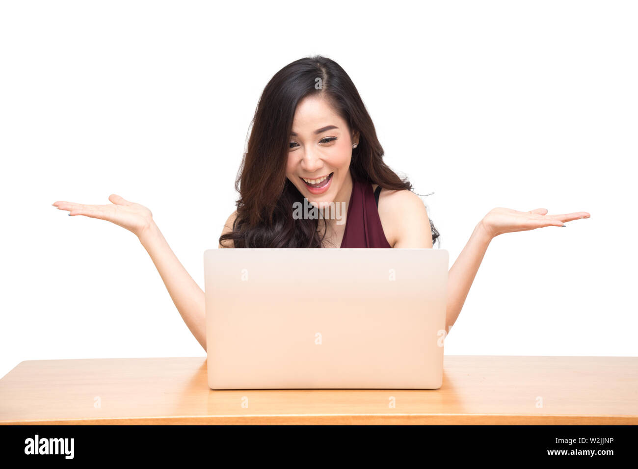 Excited young asian girl using laptop computer and celebrating success ...
