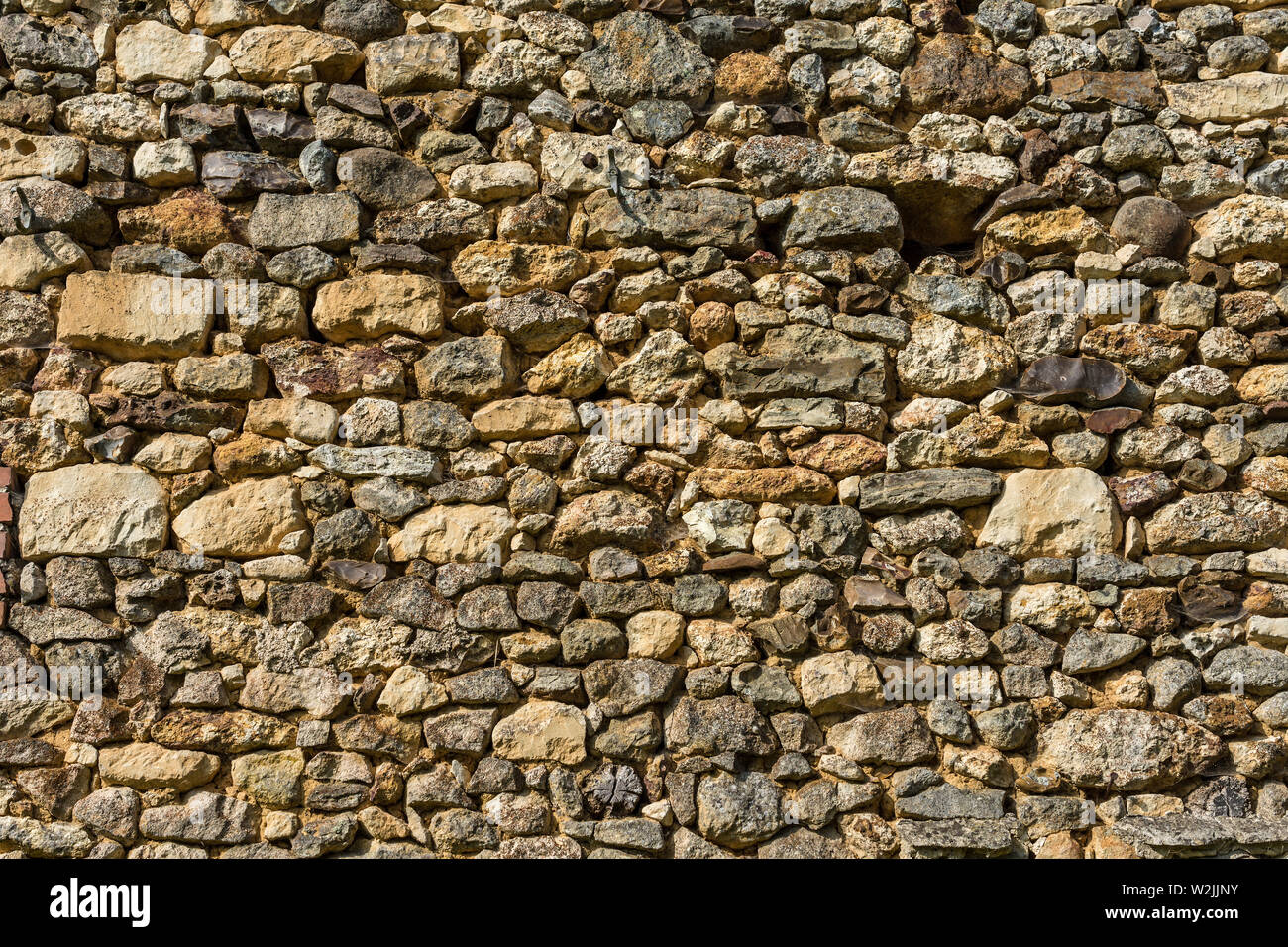 Old random course stone wall - France Stock Photo - Alamy