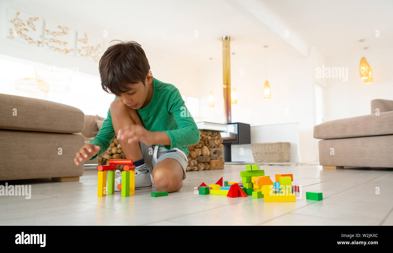 Boy playing with blocks hi-res stock photography and images - Alamy