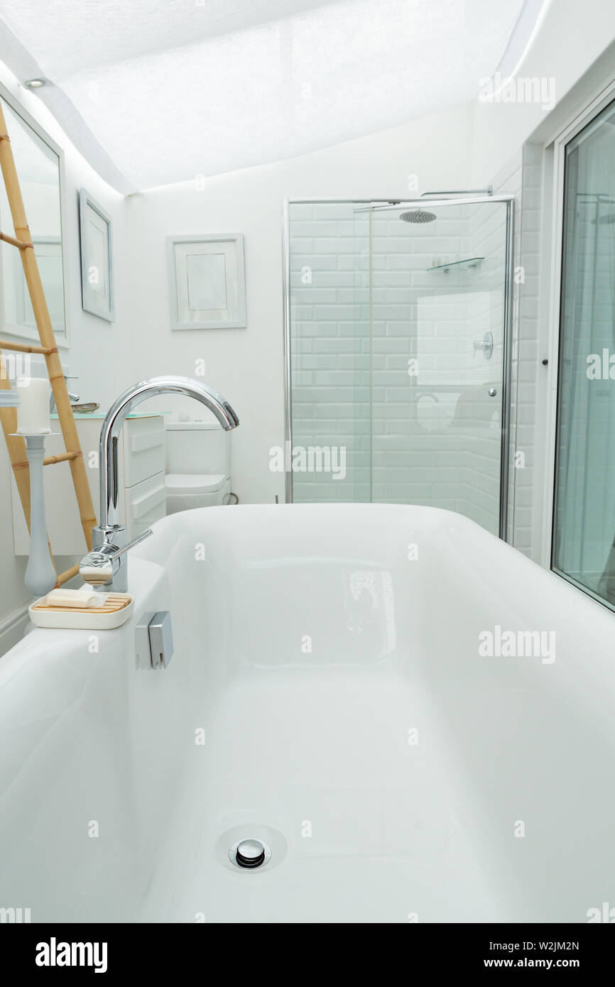 Modern bathroom interior with bathtub Stock Photo - Alamy