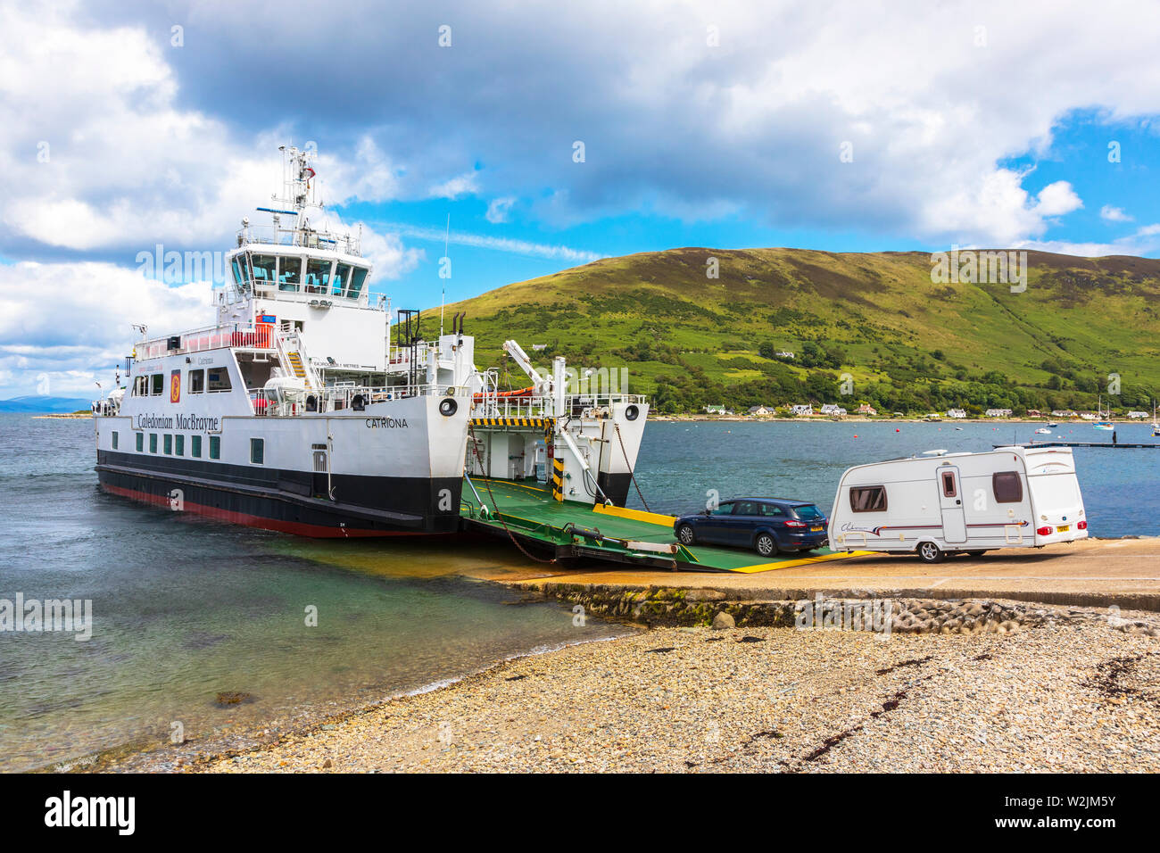 Car and caravan embarking on the Caledonian MacBrayne car ferry ...