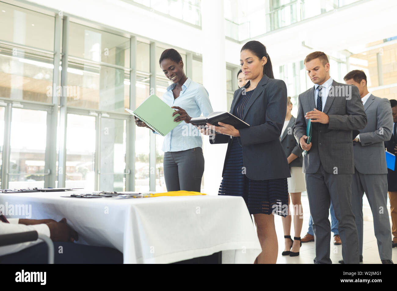 Business people queuing hi-res stock photography and images - Alamy