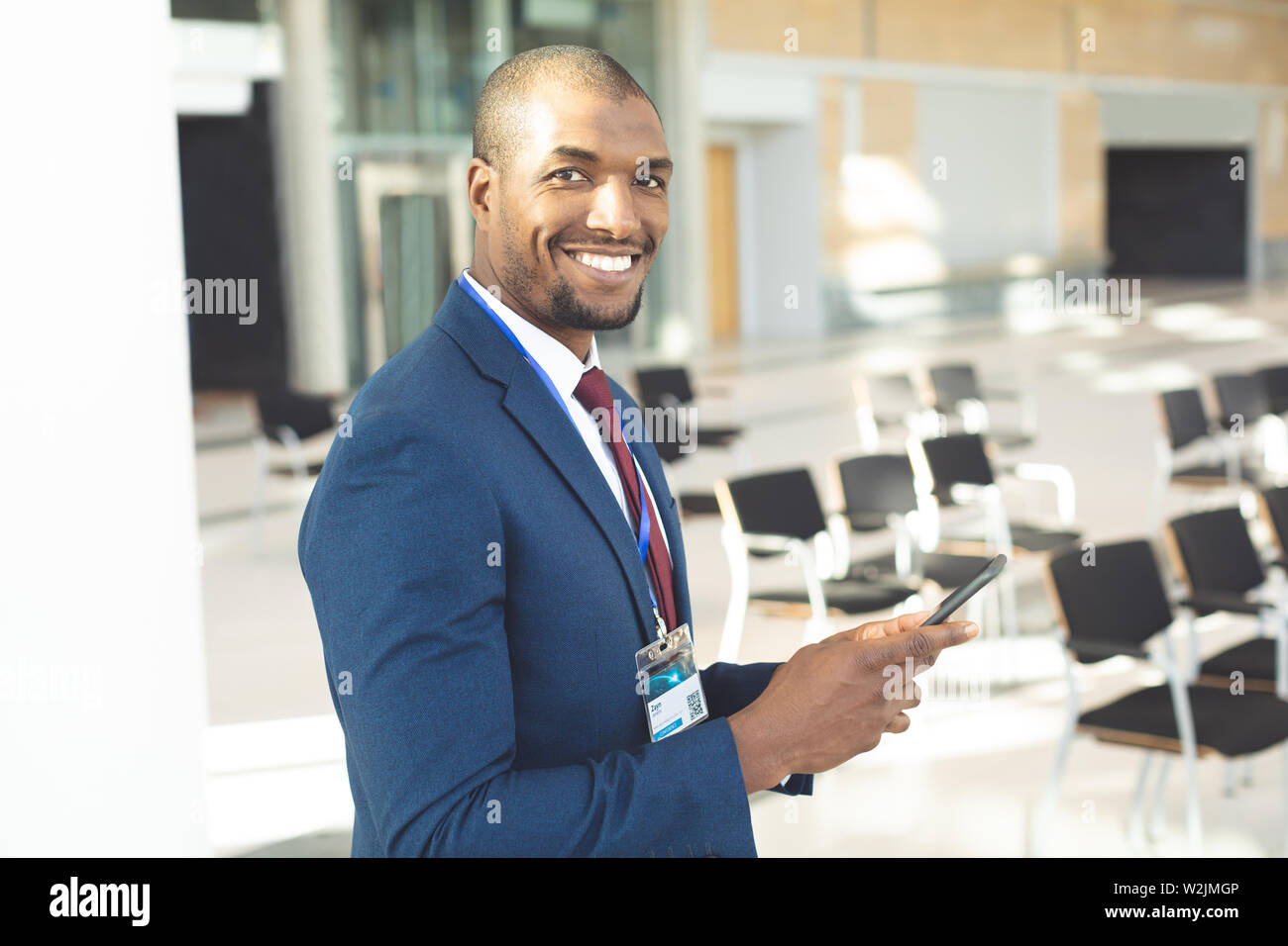African-american male executive standing in conference room with ...