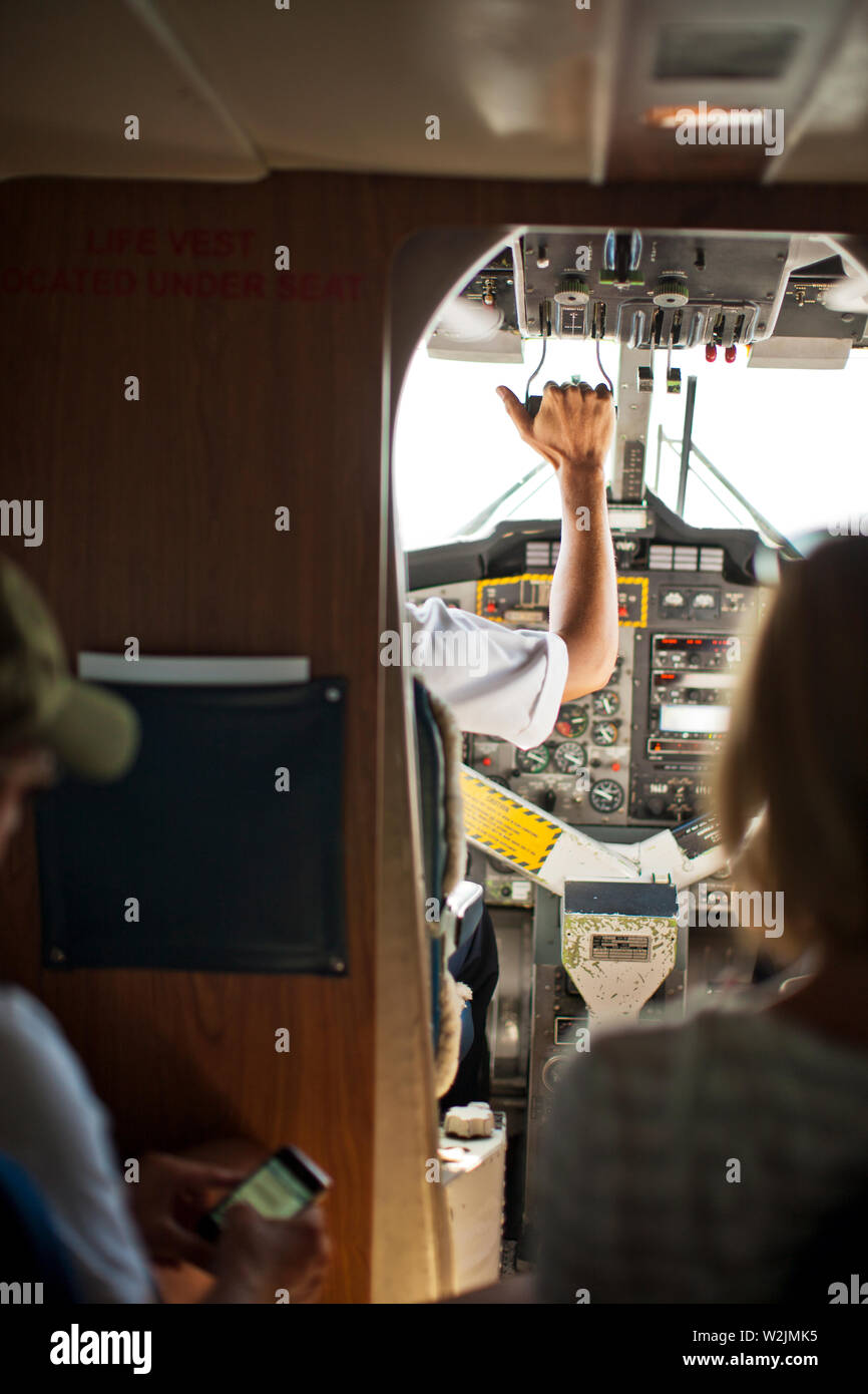 Pilot pulls a handle in the cockpit of an airplane Stock Photo - Alamy