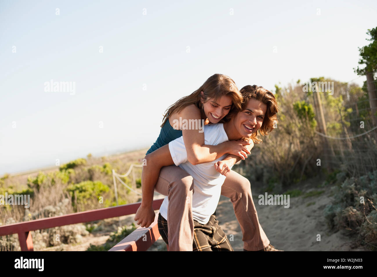 Two men giving piggy back hi-res stock photography and images - Alamy