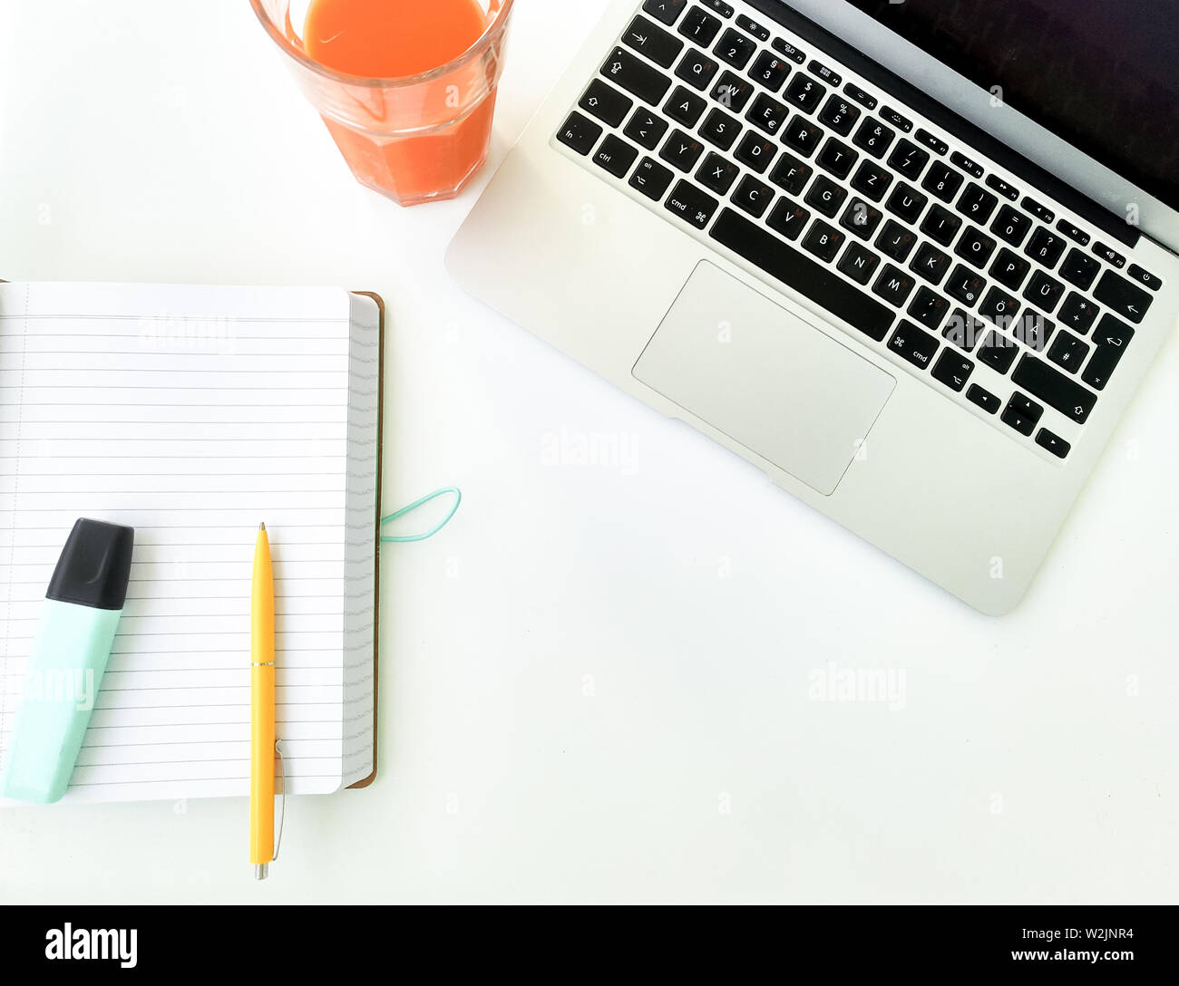 Office desk table. Laptop and notebook for planning the day. Flat lay ...