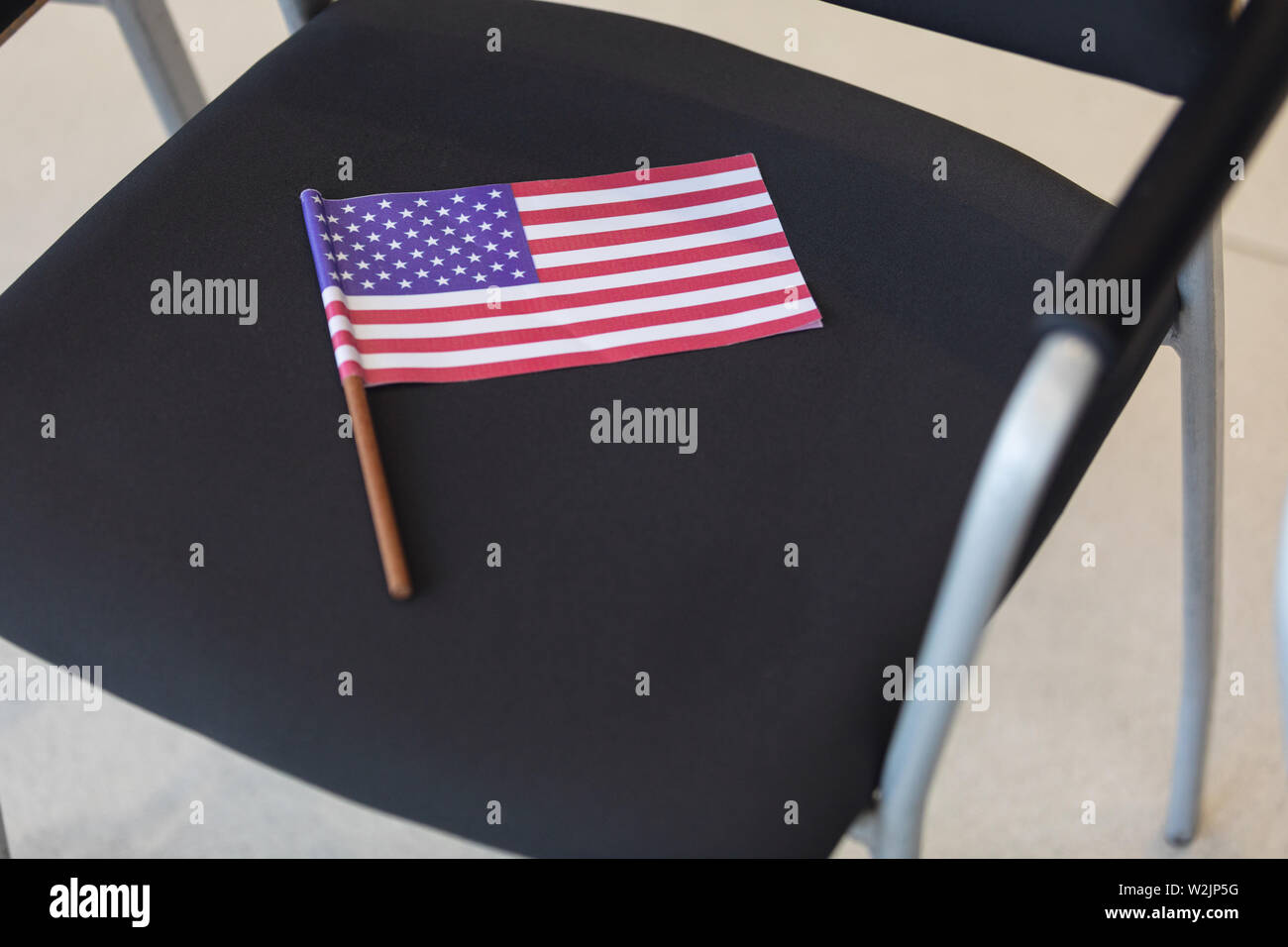 American flag on chair in conference room Stock Photo - Alamy