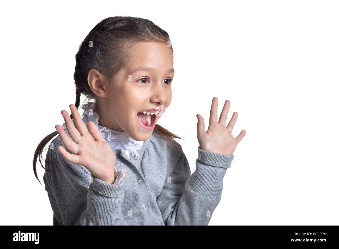 Surprised cute little girl isolated on white background Stock Photo - Alamy
