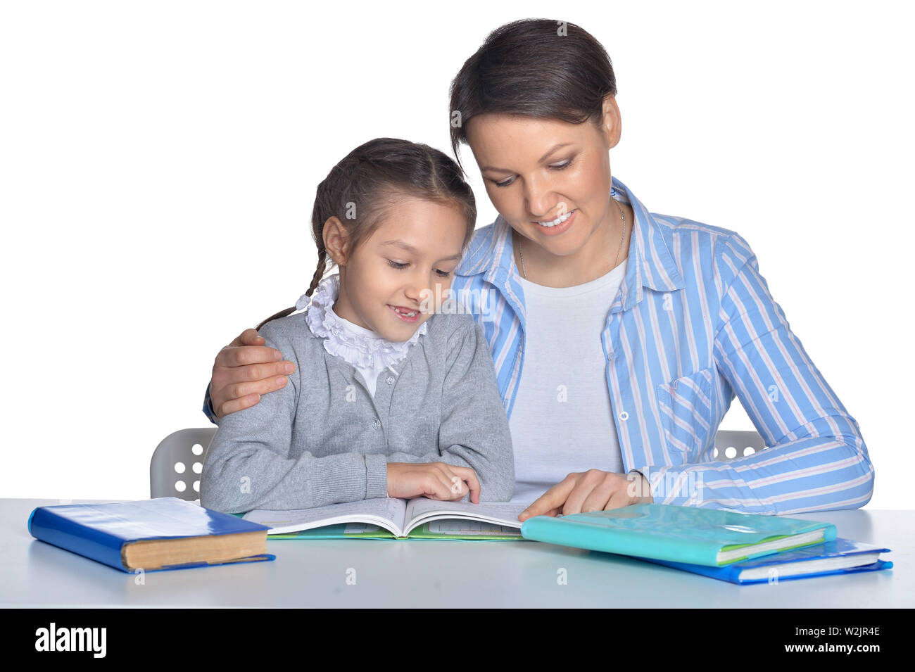 Portrait of daughter and mother reading the books Stock Photo - Alamy