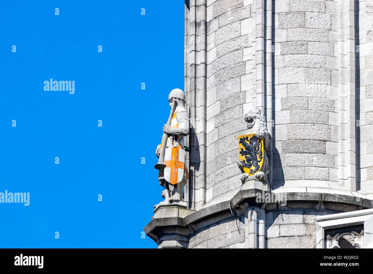 Statues of watchman in body armour holding trumpet and crossed shield ...